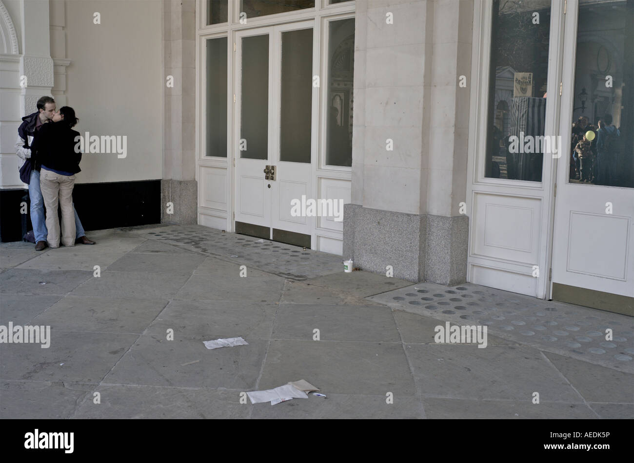 Couple kissing in street Stock Photo - Alamy