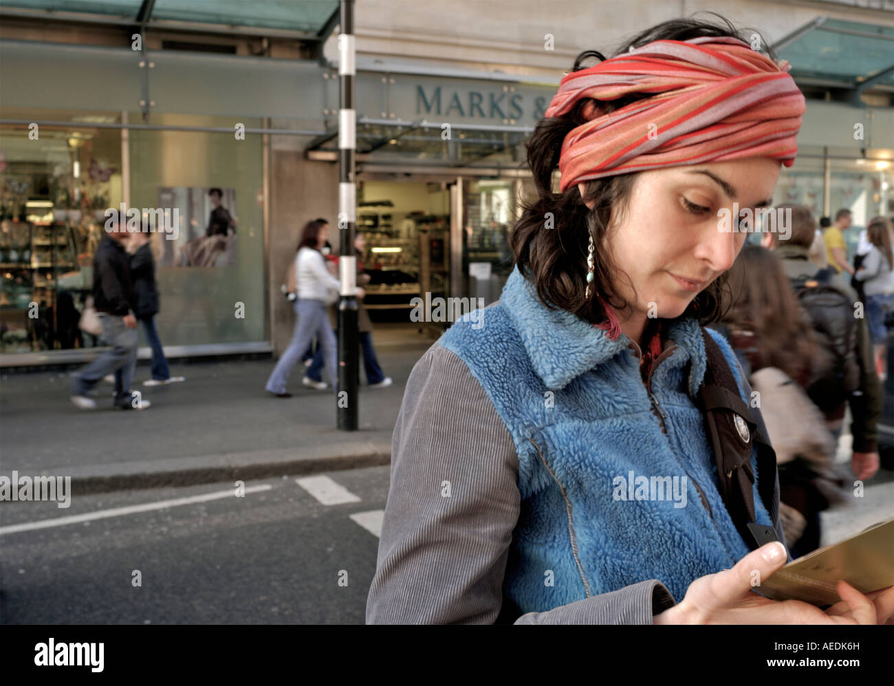Woman reading pamphlet Stock Photo - Alamy