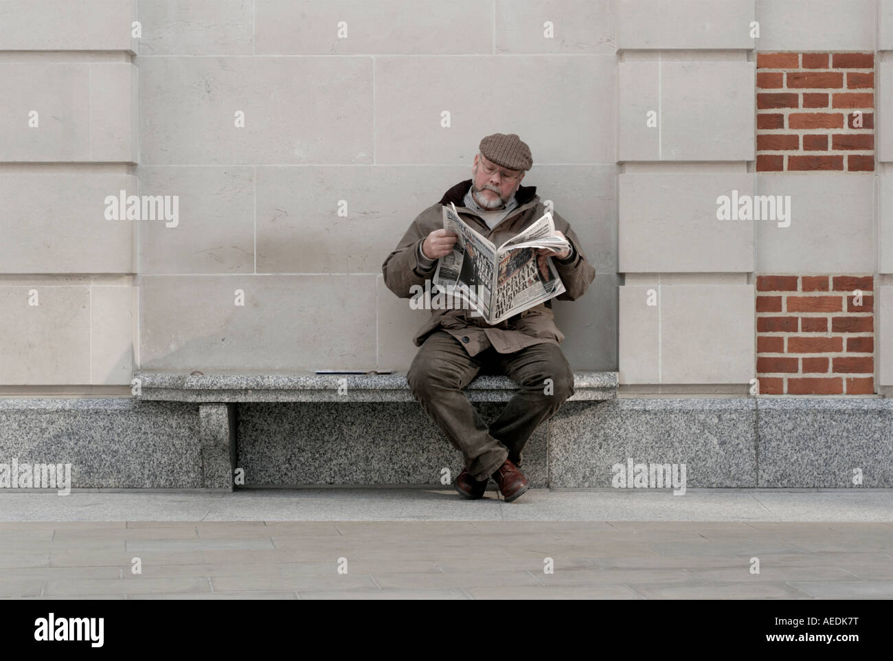 Man reading a newspaper Stock Photo - Alamy