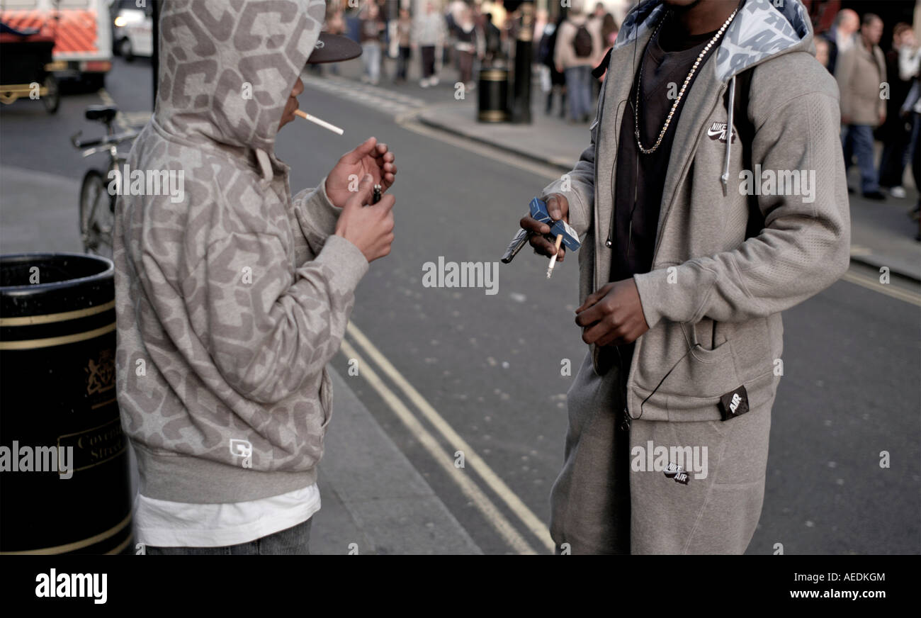 Man sharing a cigarette Stock Photo - Alamy