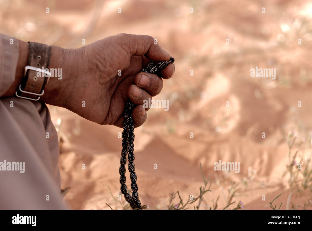Hand playing with worry beads Stock Photo - Alamy