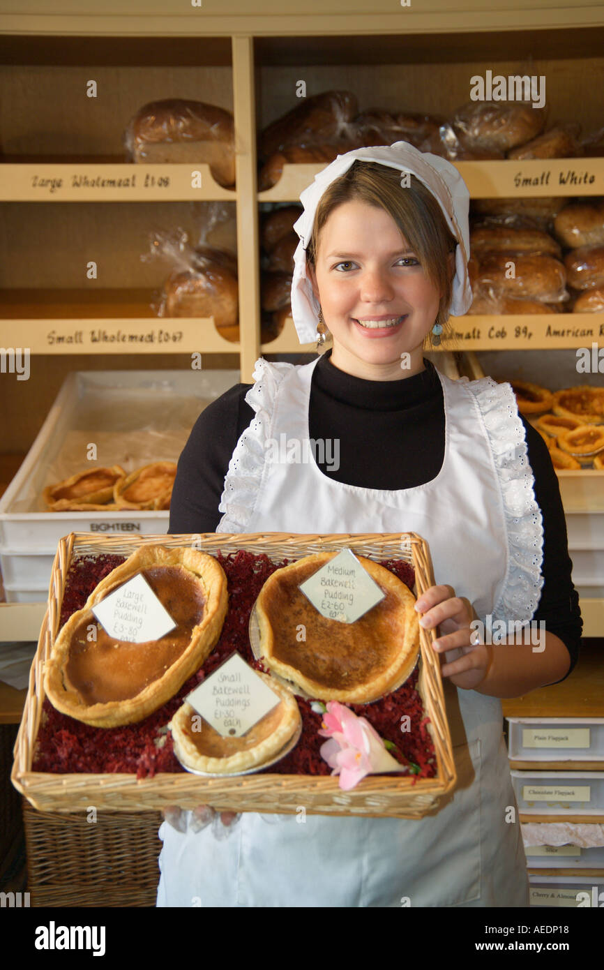 [Old Fashioned Uniform] girl [Bakewell tart] shop Stock Photo - Alamy