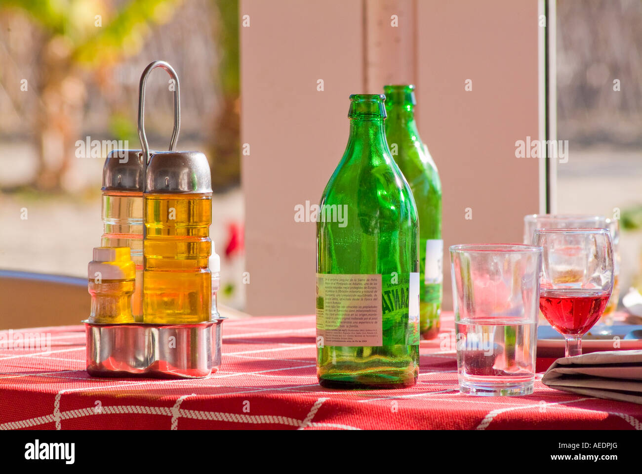 Inviting table at an outdoor cafe with bright red table cloth Stock ...
