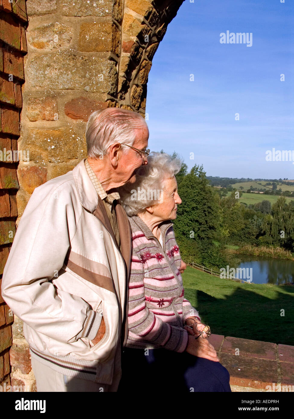 UK Oxfordshire Swerford elderly people looking out over landscape at ...