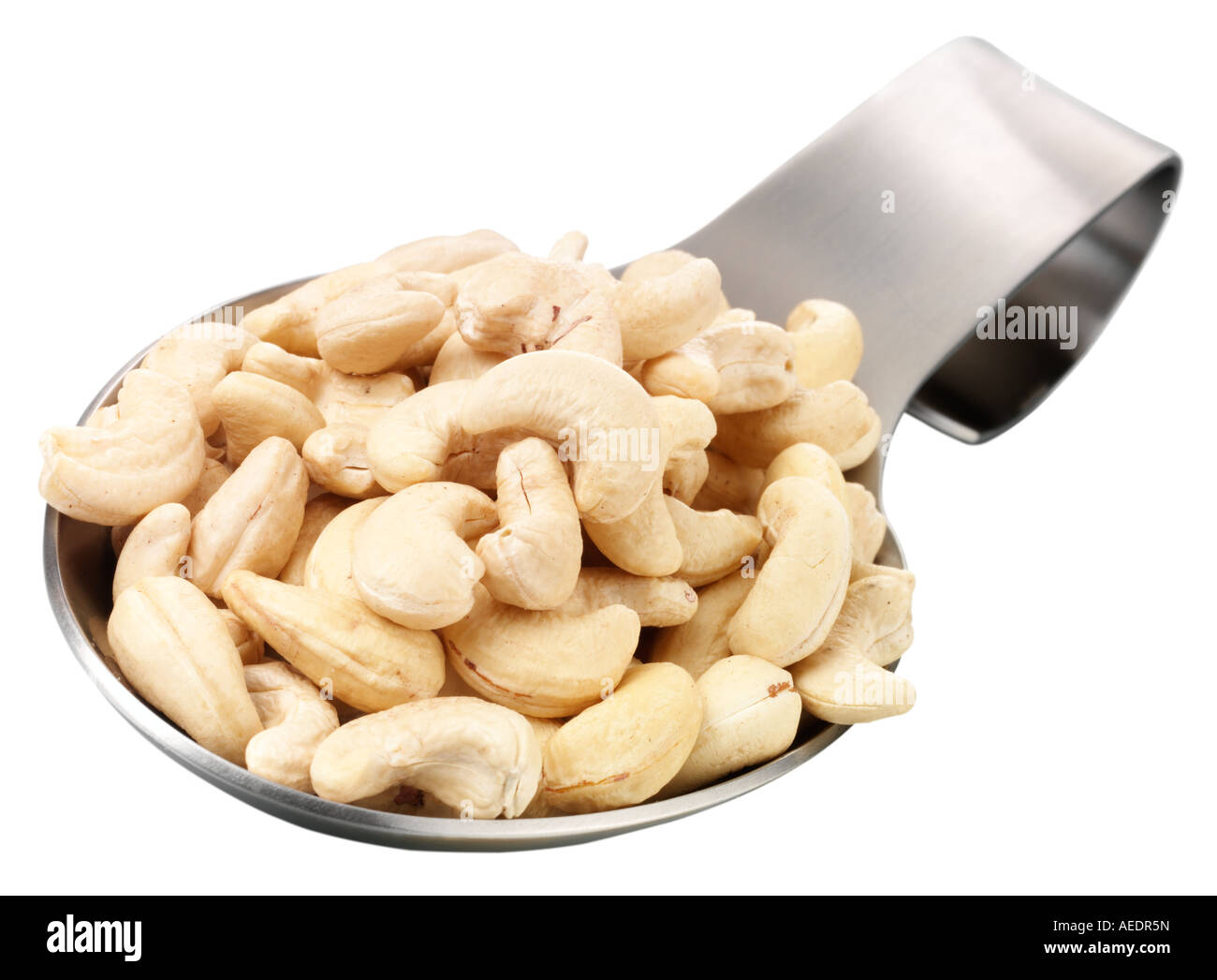 SPOONFUL OF CASHEW NUTS CUT OUT Stock Photo - Alamy