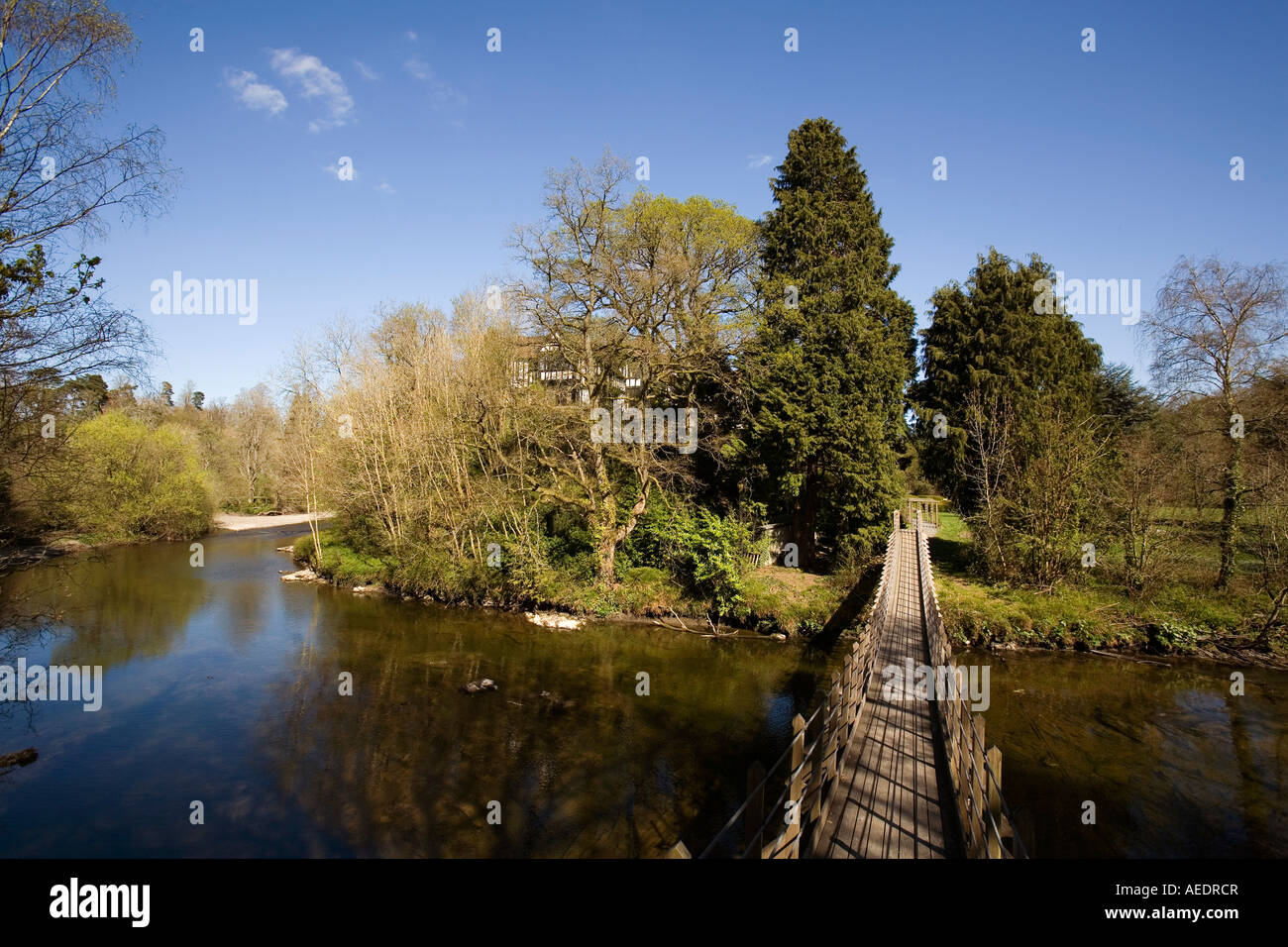 Wales Powys Builth Wells wooden suspension footbridge over Irfon River ...