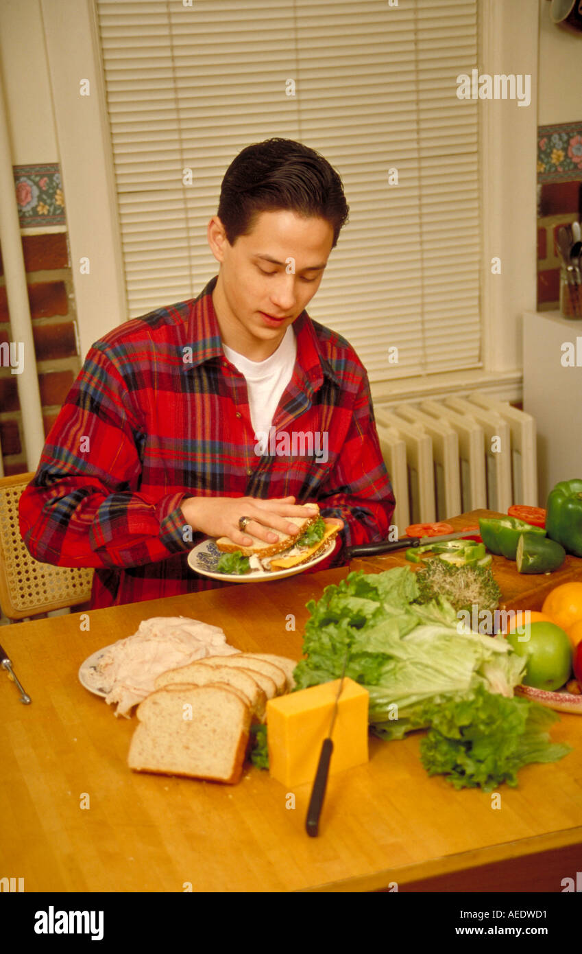 Young white man making a sandwich St Paul Minnesota Stock Photo - Alamy