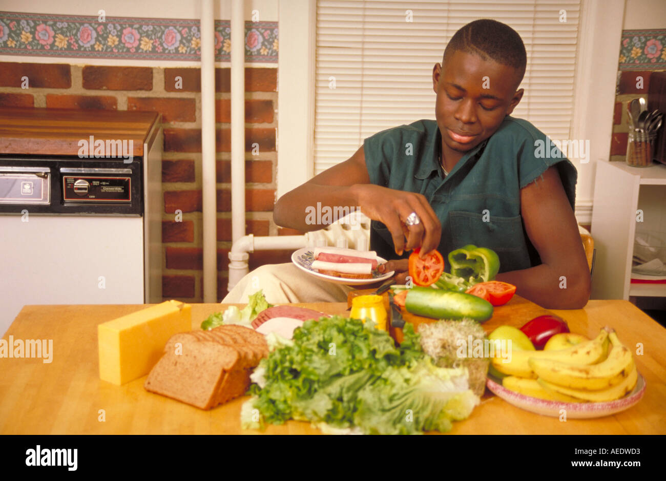 Young black man making a sandwich St Paul Minnesota Stock Photo - Alamy