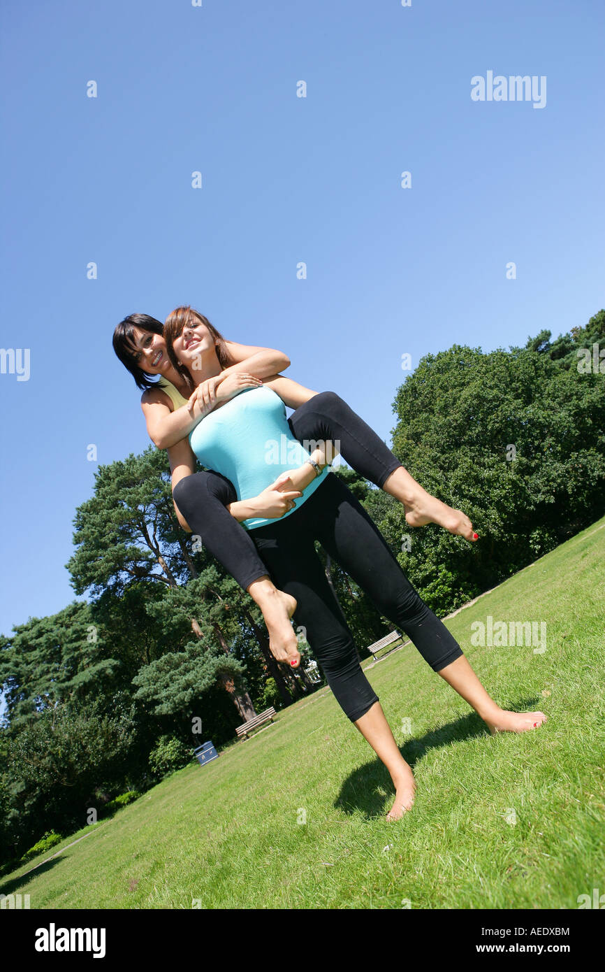 Teenagers Giving Piggybacks Model Released Stock Photo - Alamy