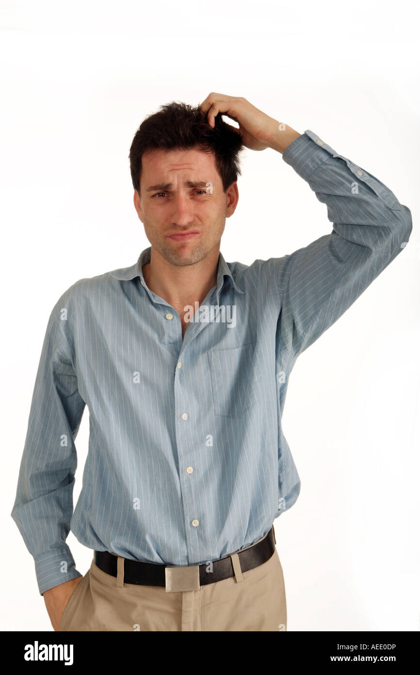 Young man looking confused Stock Photo - Alamy