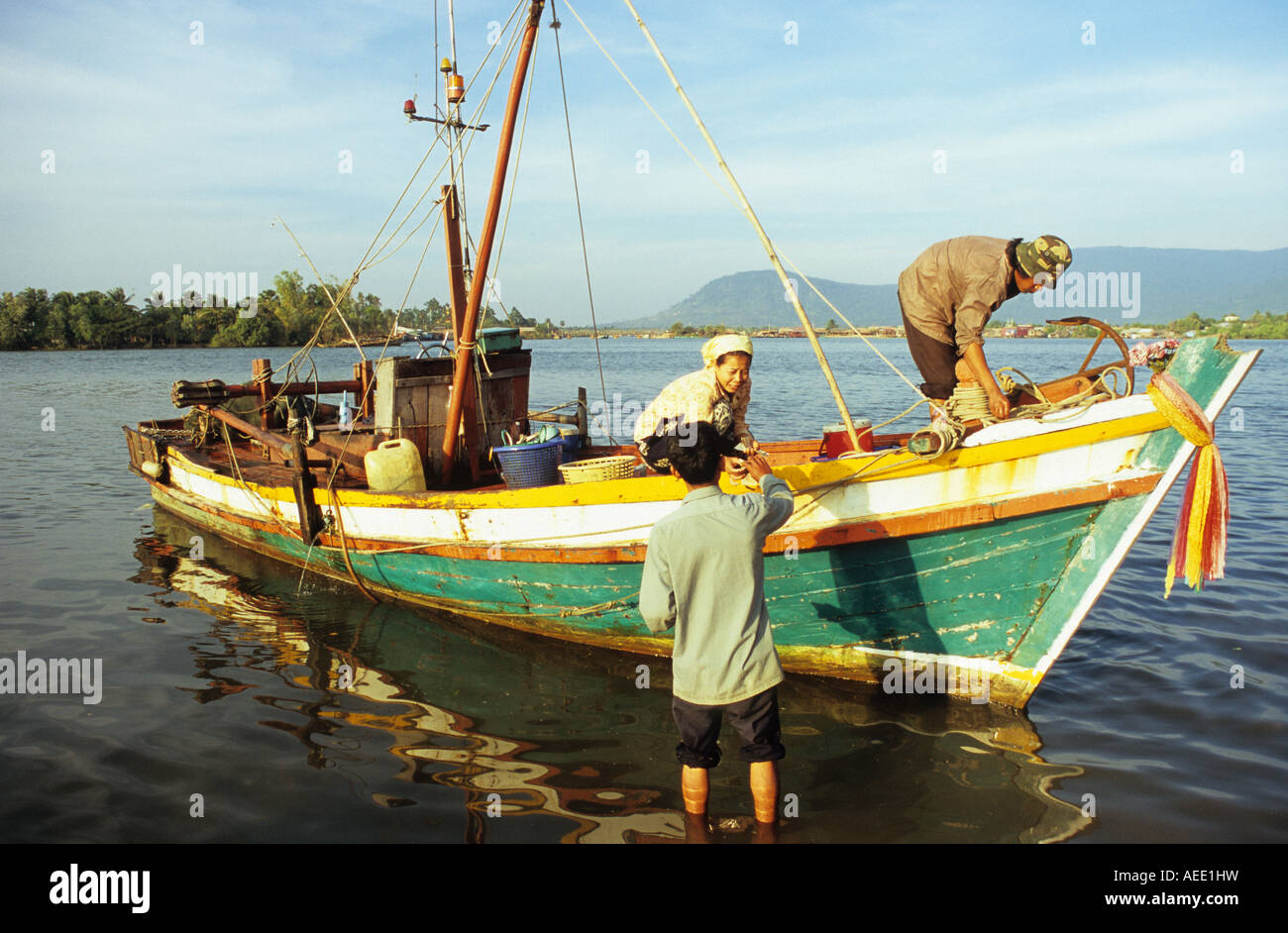 Cham fishermen on a fishing boat on the Sanke river, Kampot, Cambodia ...