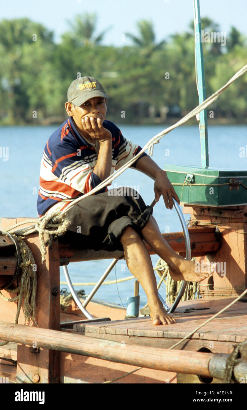 Man sitting stern boat hi-res stock photography and images - Alamy