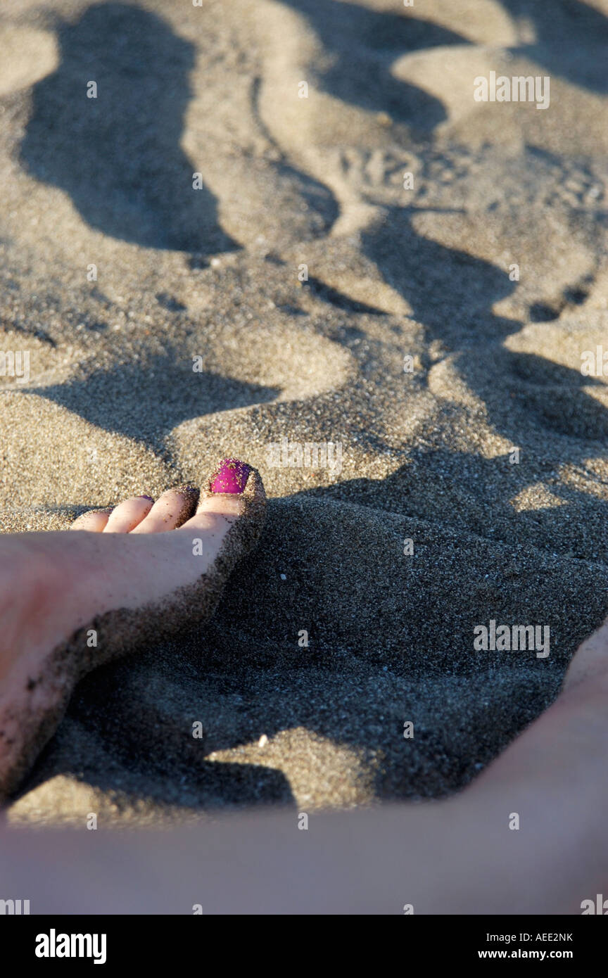 Sandy toes on a sunny beach Stock Photo - Alamy