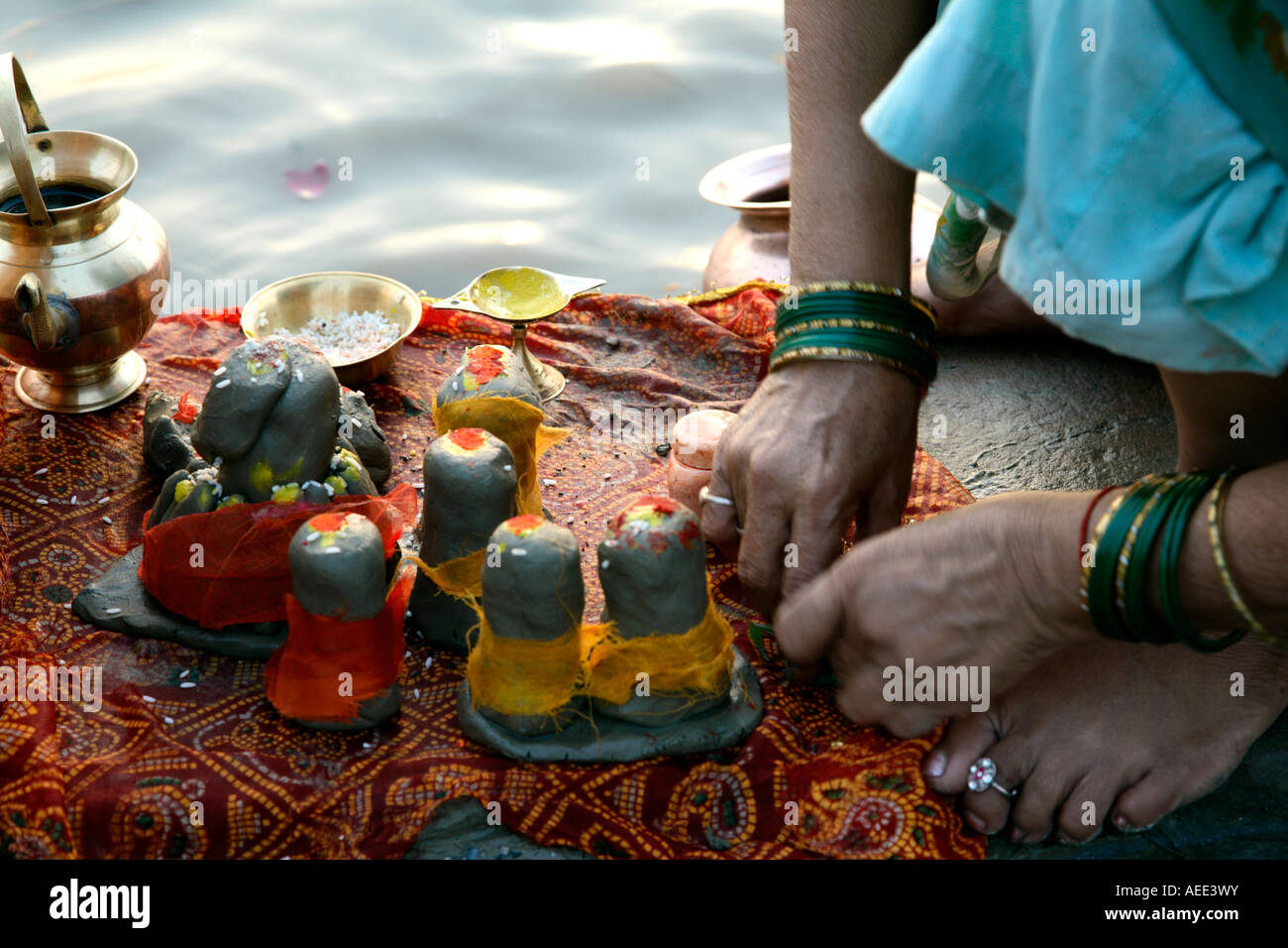 Woman performing ritual puja ceremony. Shivala Ghat. Ganges river ...