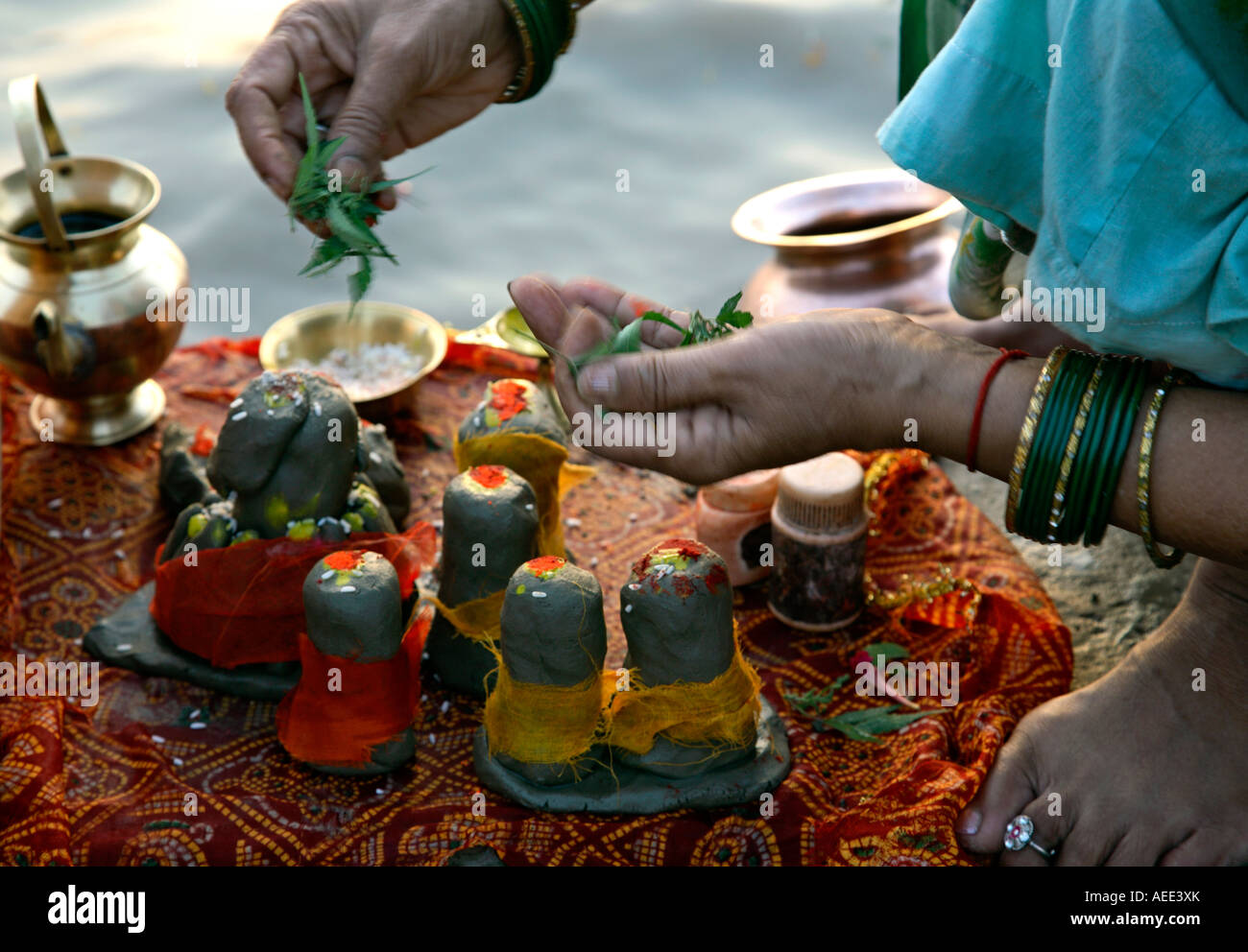 Woman performing ritual puja ceremony. Shivala Ghat. Ganges river ...
