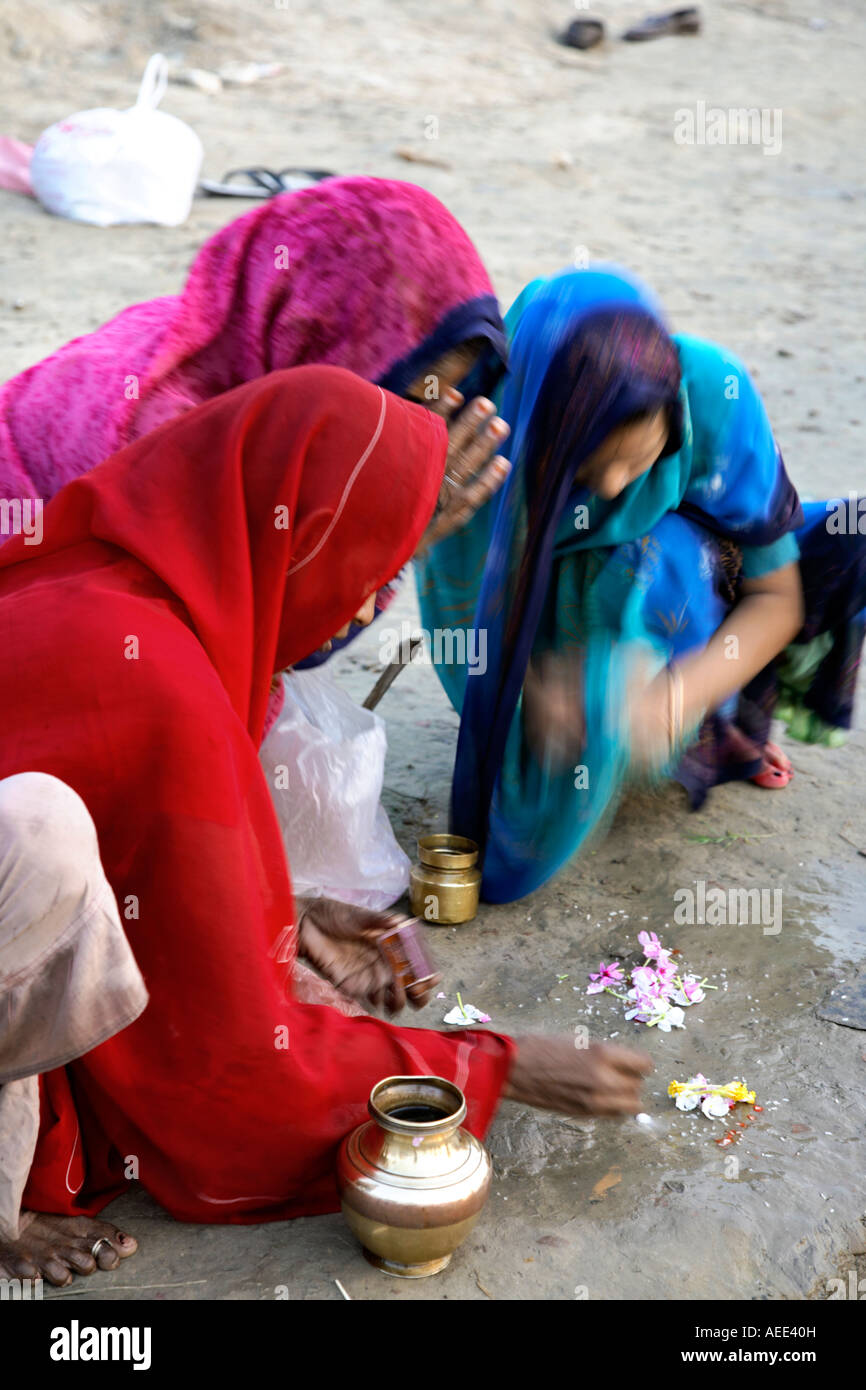 Women performing ritual puja ceremony. Tulsi Ghat. Ganges river ...