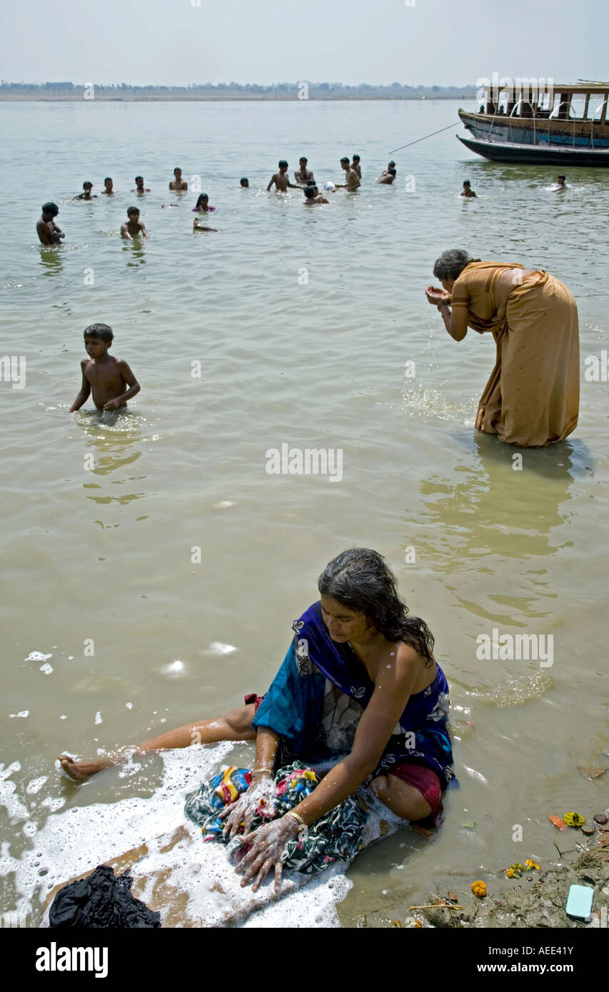 Doing the laundry and bathing. Shivala Ghat. Ganges river. Varanasi ...