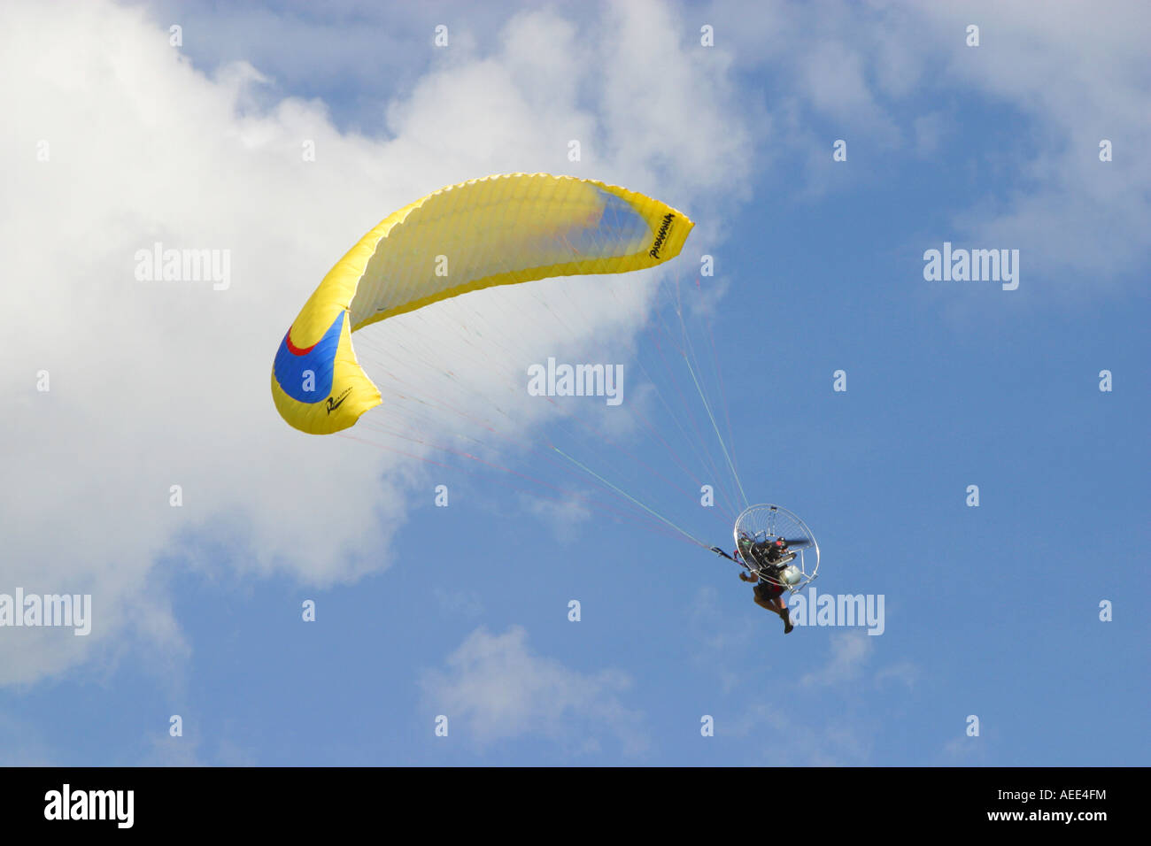 Powered paraglider in flight Stock Photo - Alamy