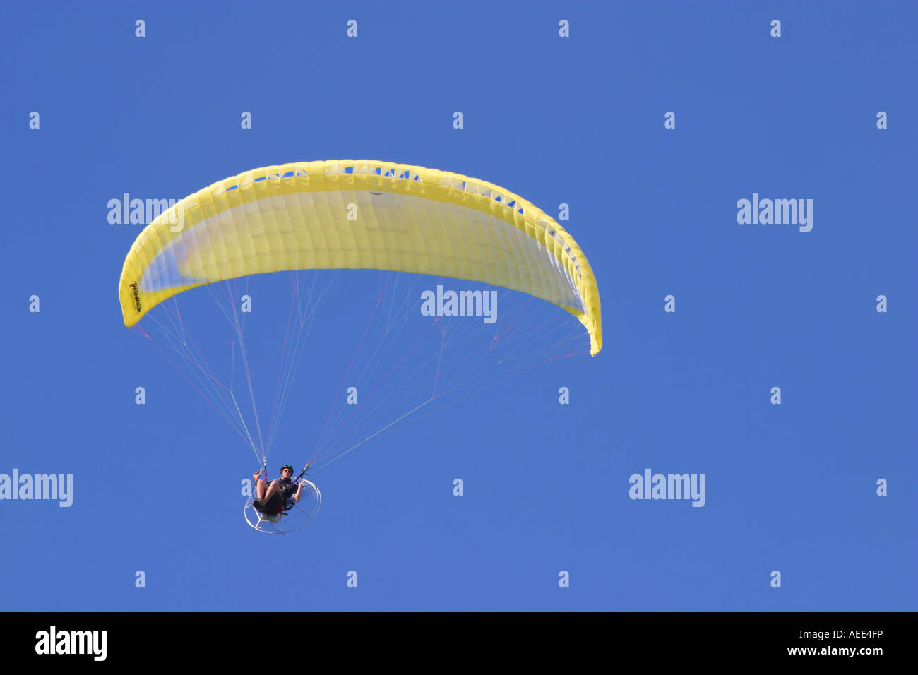 Powered paraglider in flight Stock Photo - Alamy
