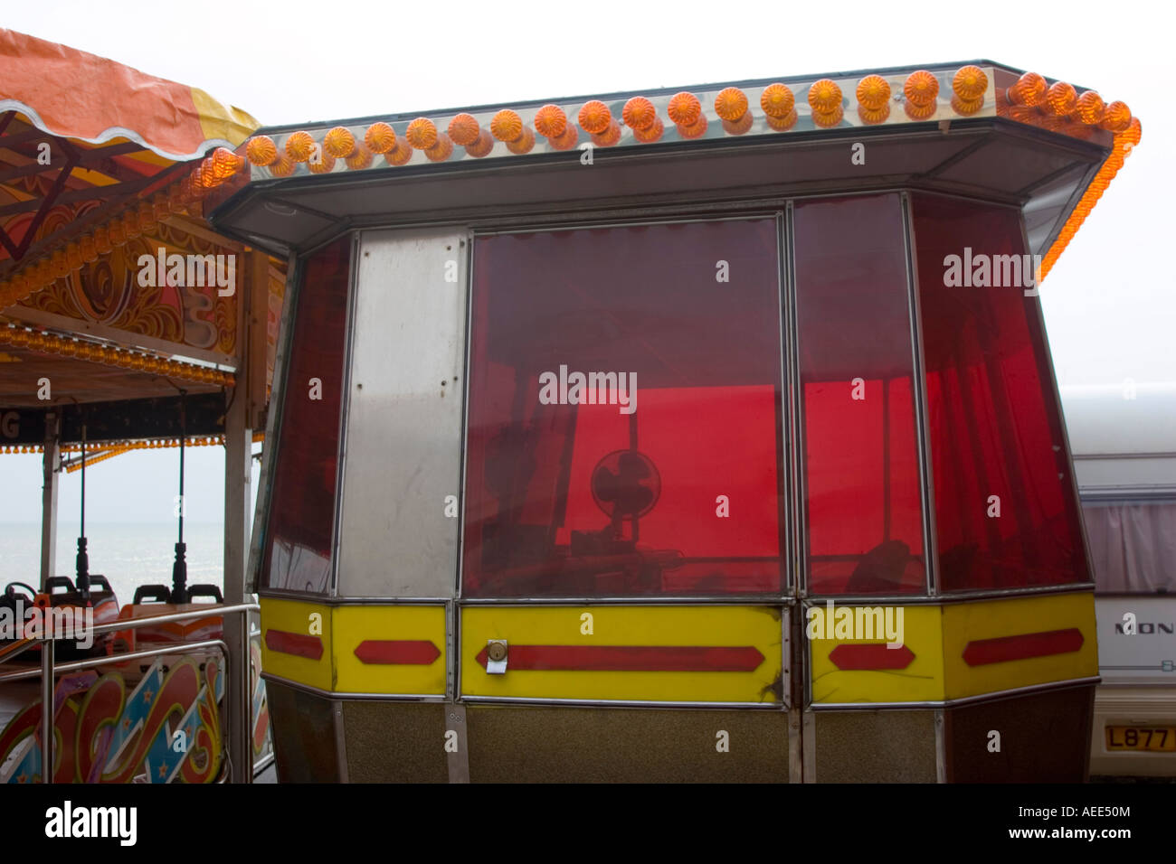 Funfair red tinted glass booth Stock Photo - Alamy