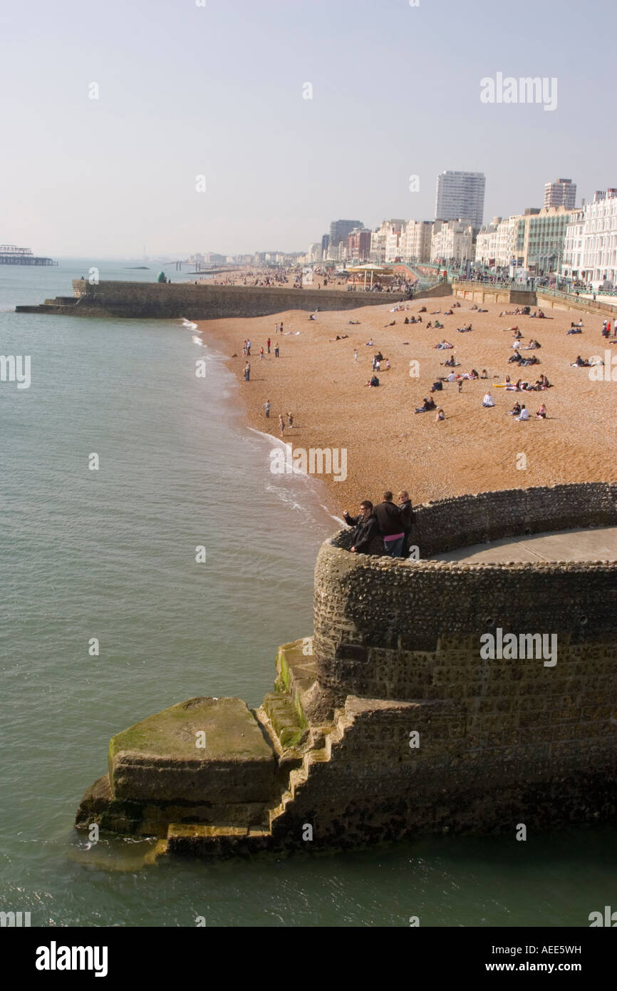 A busy and crowded Brighton beach and sea front on an unseasonably warm ...