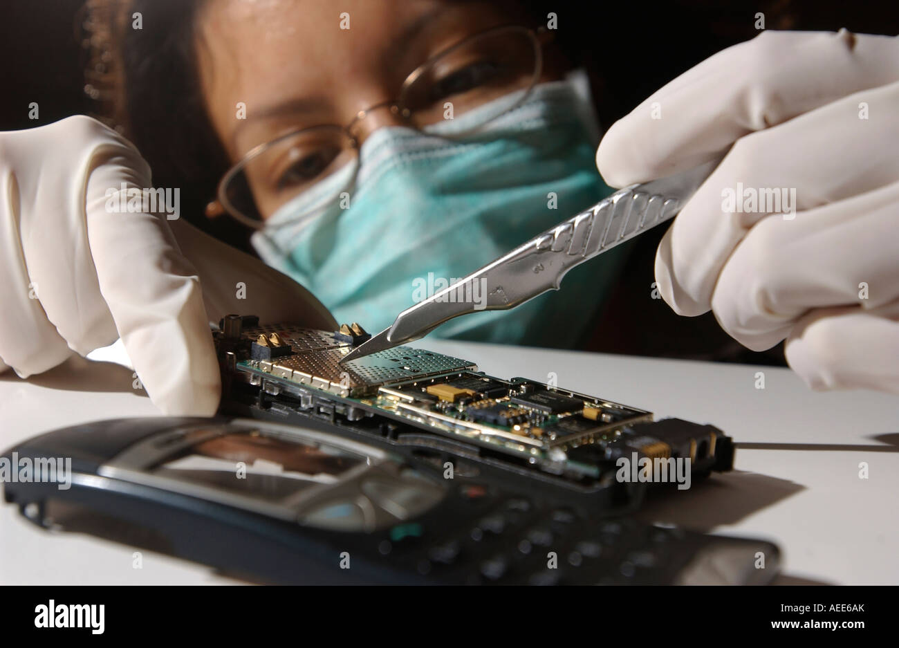 Mobile phone being dissected Stock Photo - Alamy