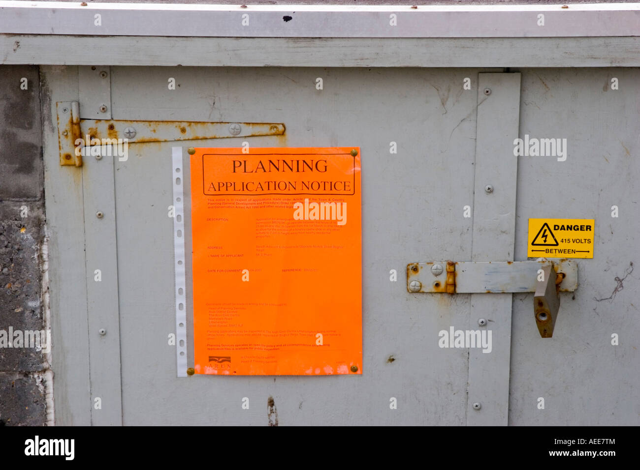 Orange planning application notice on grey wooden doors Stock Photo - Alamy