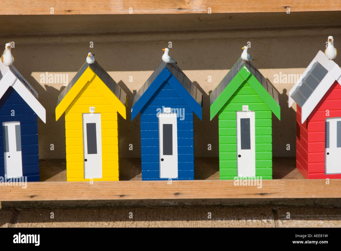 Model beach huts in a shop window Stock Photo - Alamy