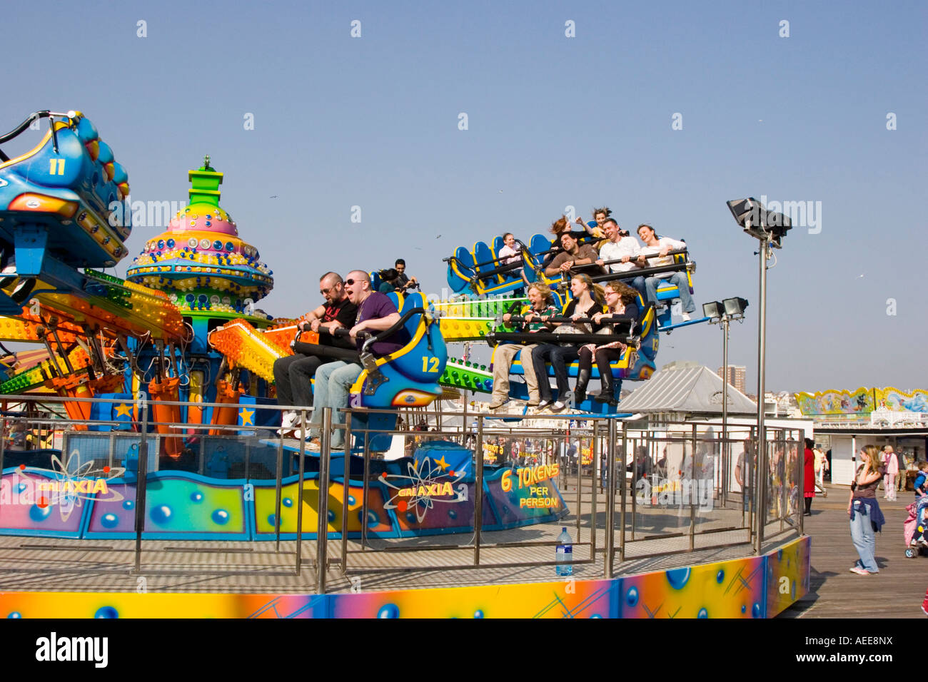 People enjoying a fairground ride Stock Photo - Alamy