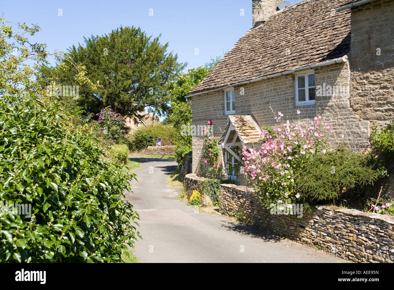 A stone cottage in the Cotswold village of Eastleach Turville ...