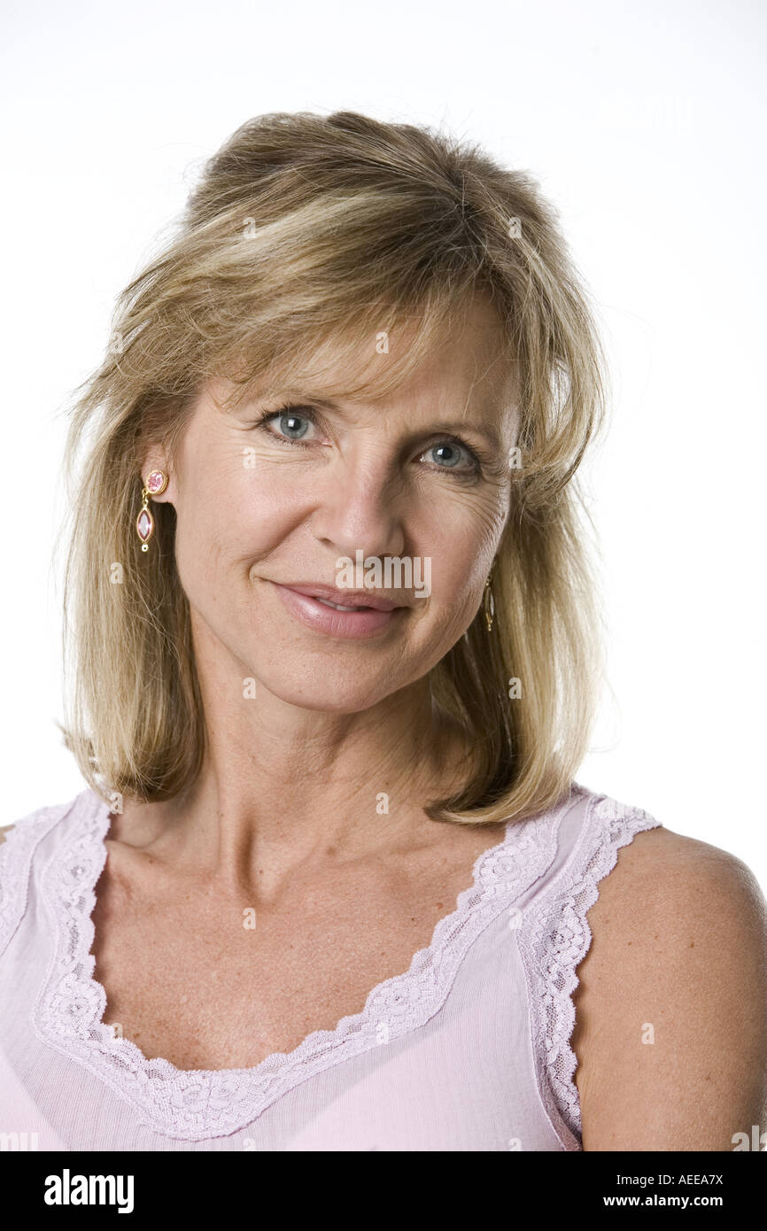 A portrait of a woman in her 40's wearing a pink top Stock Photo - Alamy