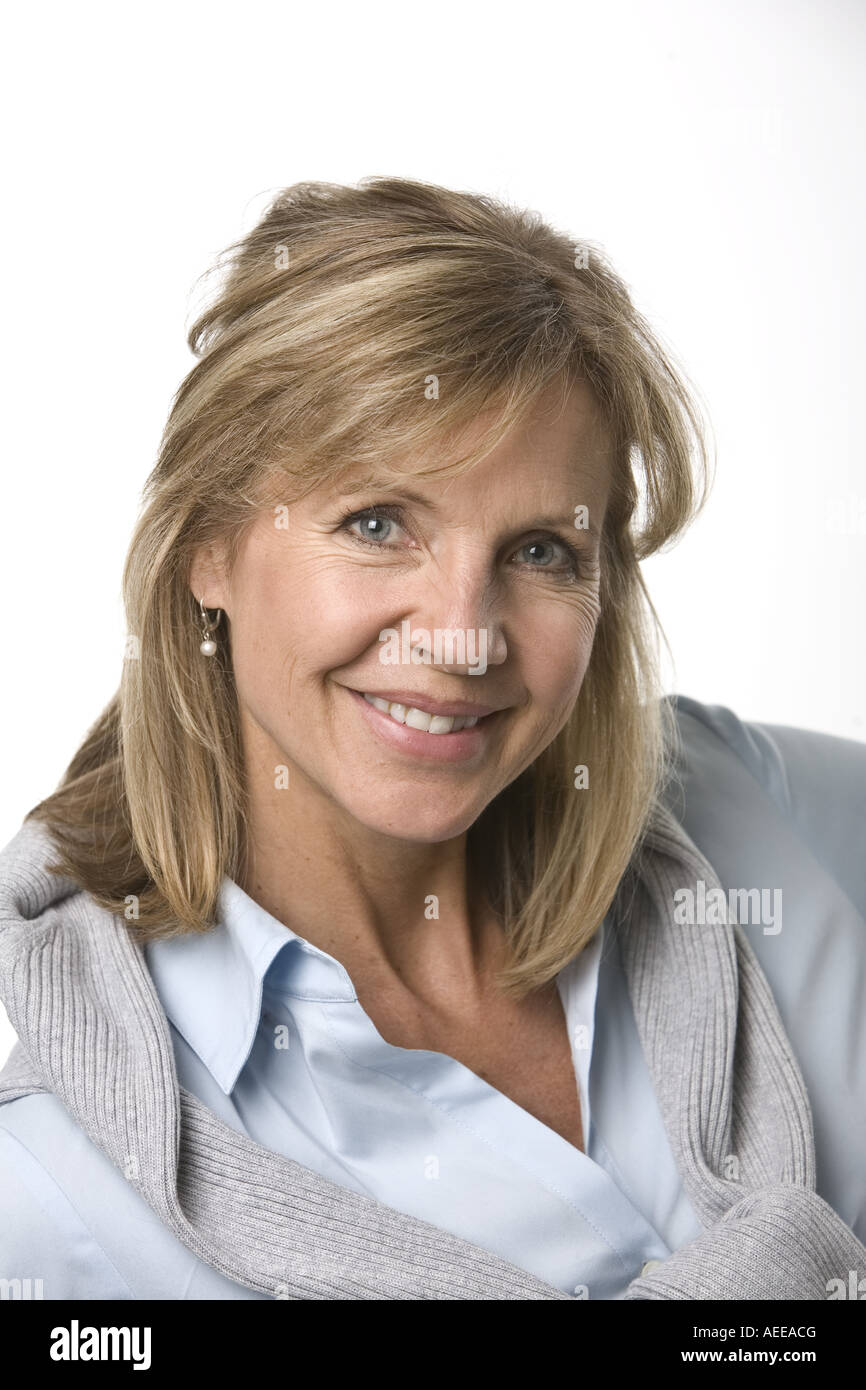 A woman poses for photographs in a studio Stock Photo - Alamy