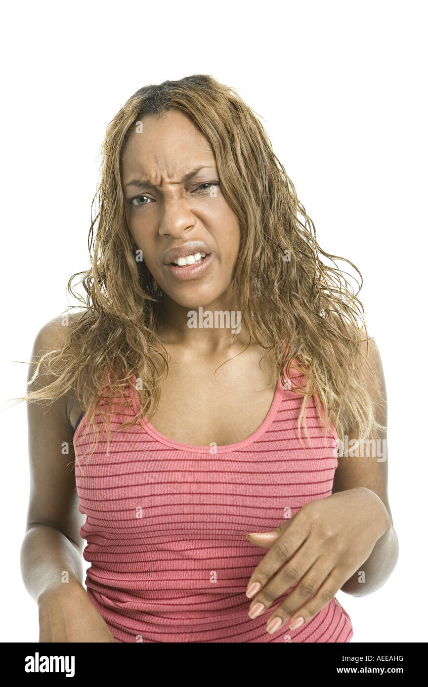 A young woman looking upset poses in a studio Stock Photo - Alamy