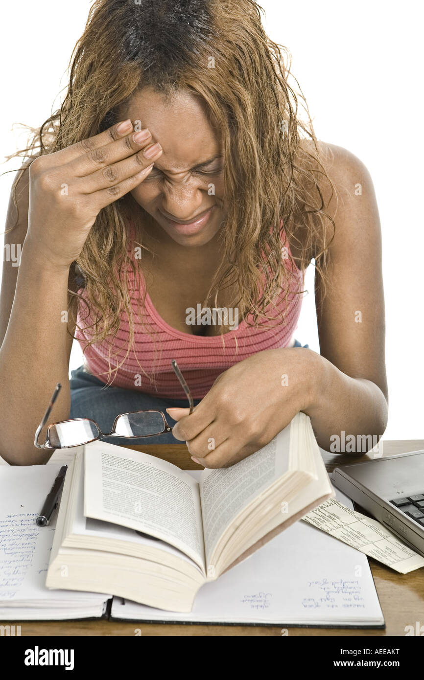 A young woman studying and reading Stock Photo - Alamy