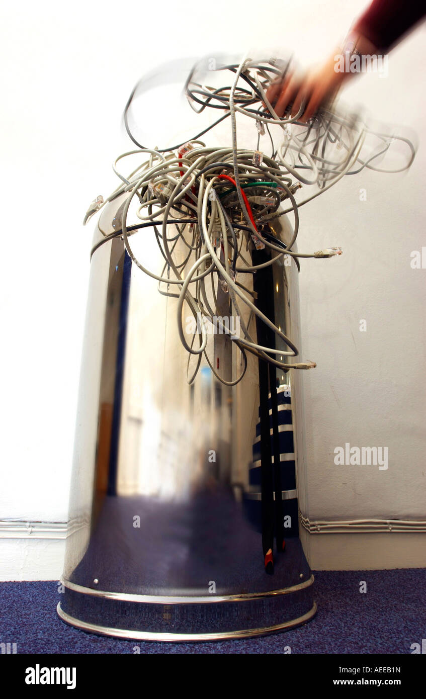 Person throwing internet cables into rubbish bin Stock Photo - Alamy