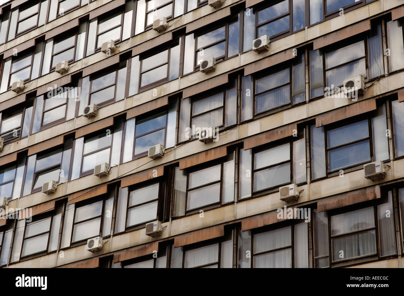facade of an old commercial building with windows in a symmetrical ...