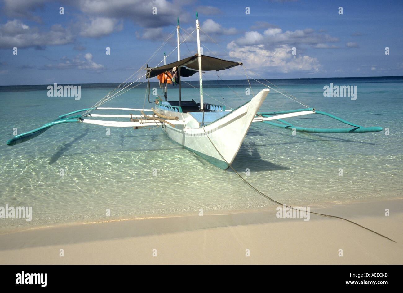 One of the brightly painted boats at the spectacular Boracay beach ...