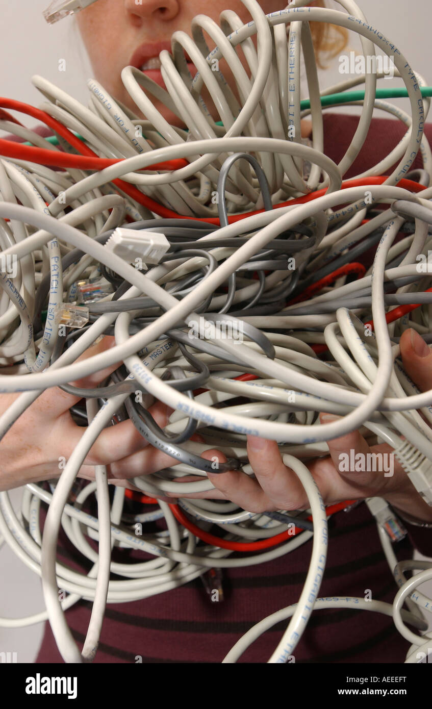 Person holding pile of cables Stock Photo - Alamy