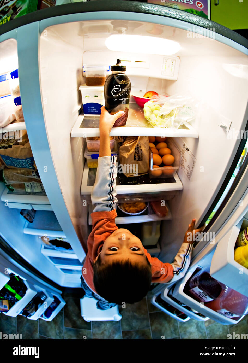 Children raiding the fridge hi-res stock photography and images - Alamy