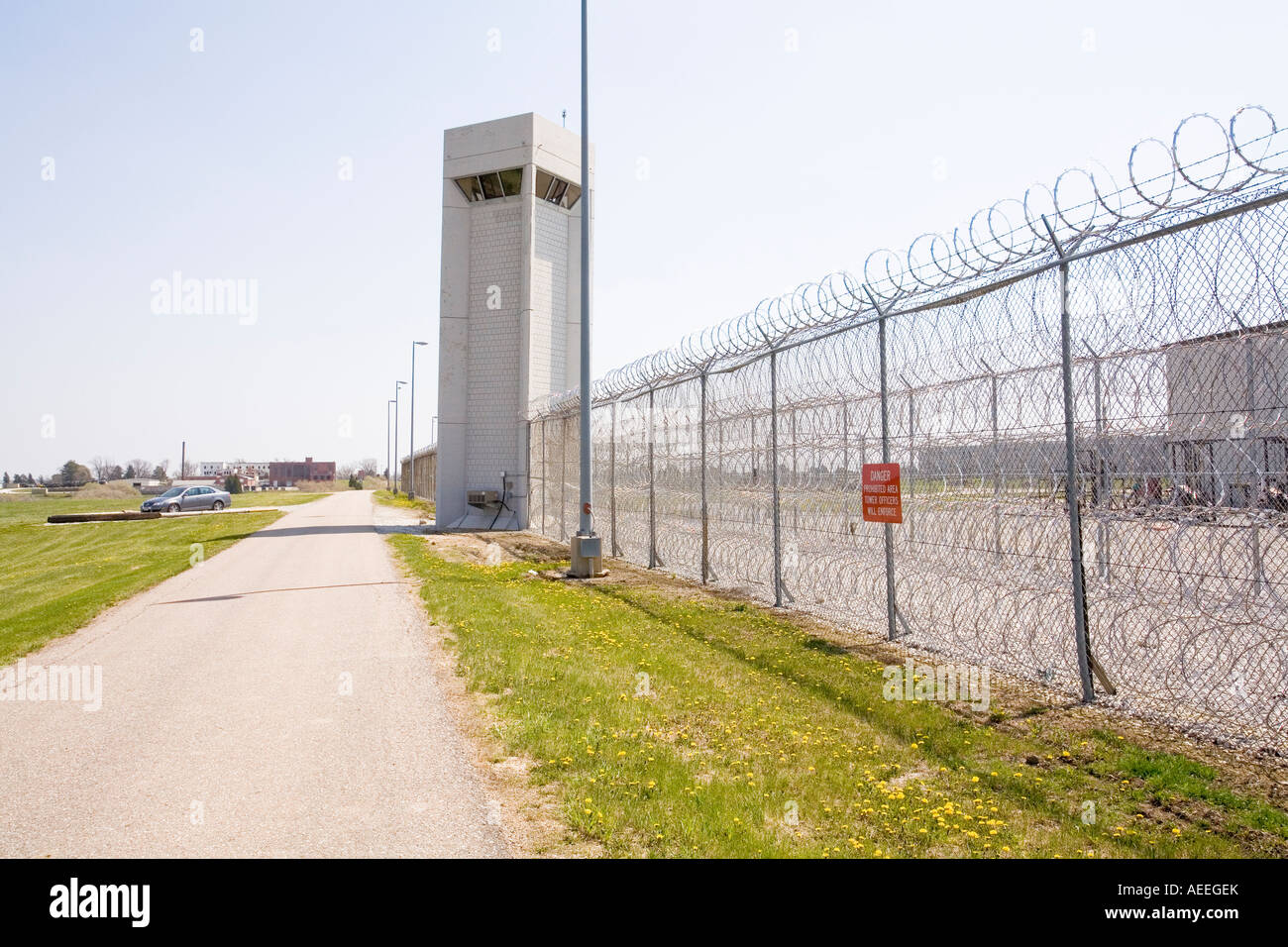 Perimeter fence and guard tower at the Lincoln Correctional Center ...