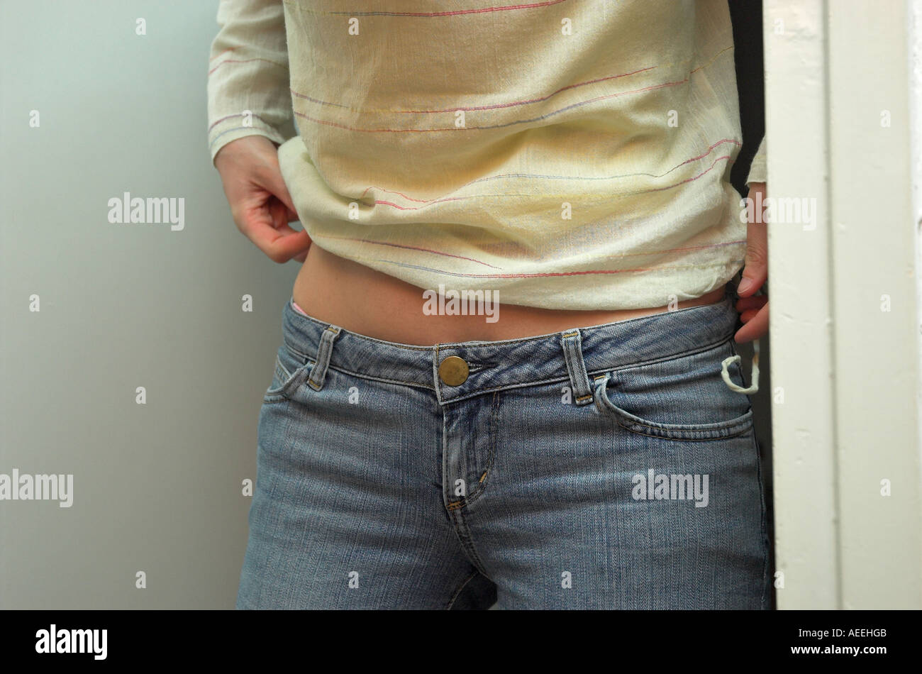 Woman Getting Dressed Stock Photo - Alamy