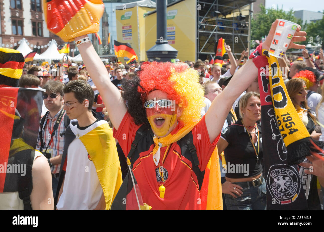 A German football fan cheering in good mood at a football world cup ...
