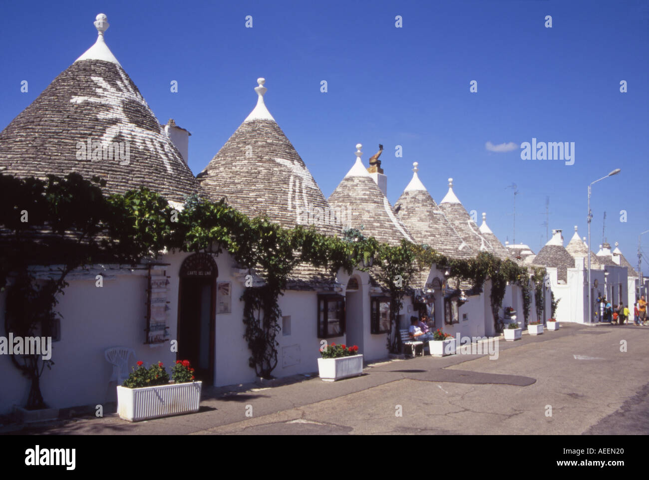 A street of Trulli with mystic roof symbols Alberobello Puglia Italy ...