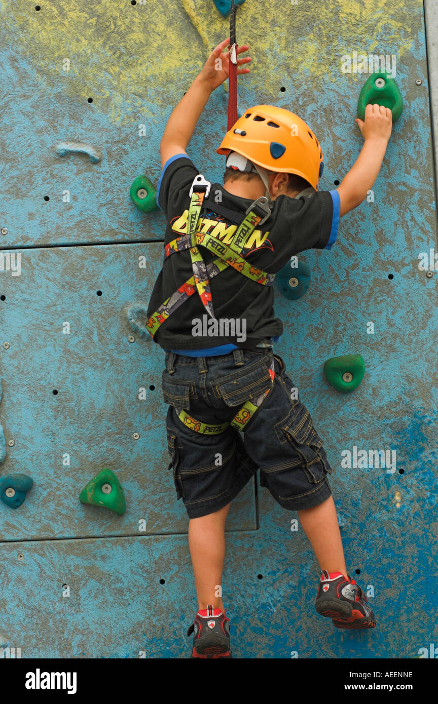 Young boy on climbing wall Stock Photo - Alamy