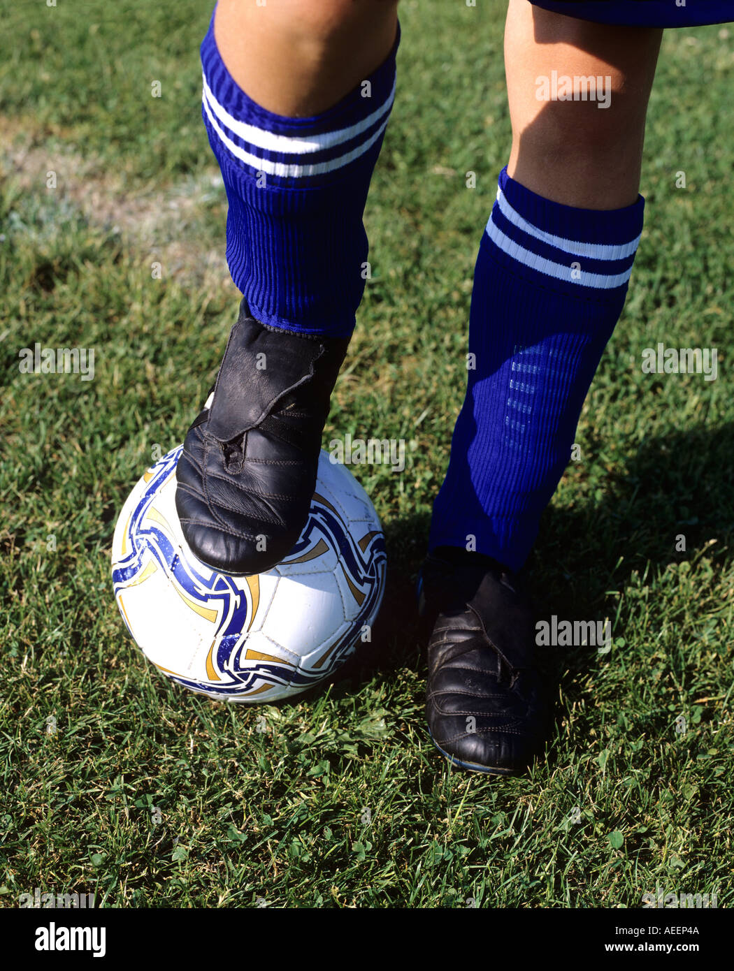 close up of football player s legs and boots with ball Stock Photo - Alamy
