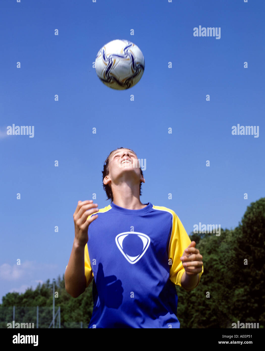 young footballer doing headers during football training Stock Photo - Alamy
