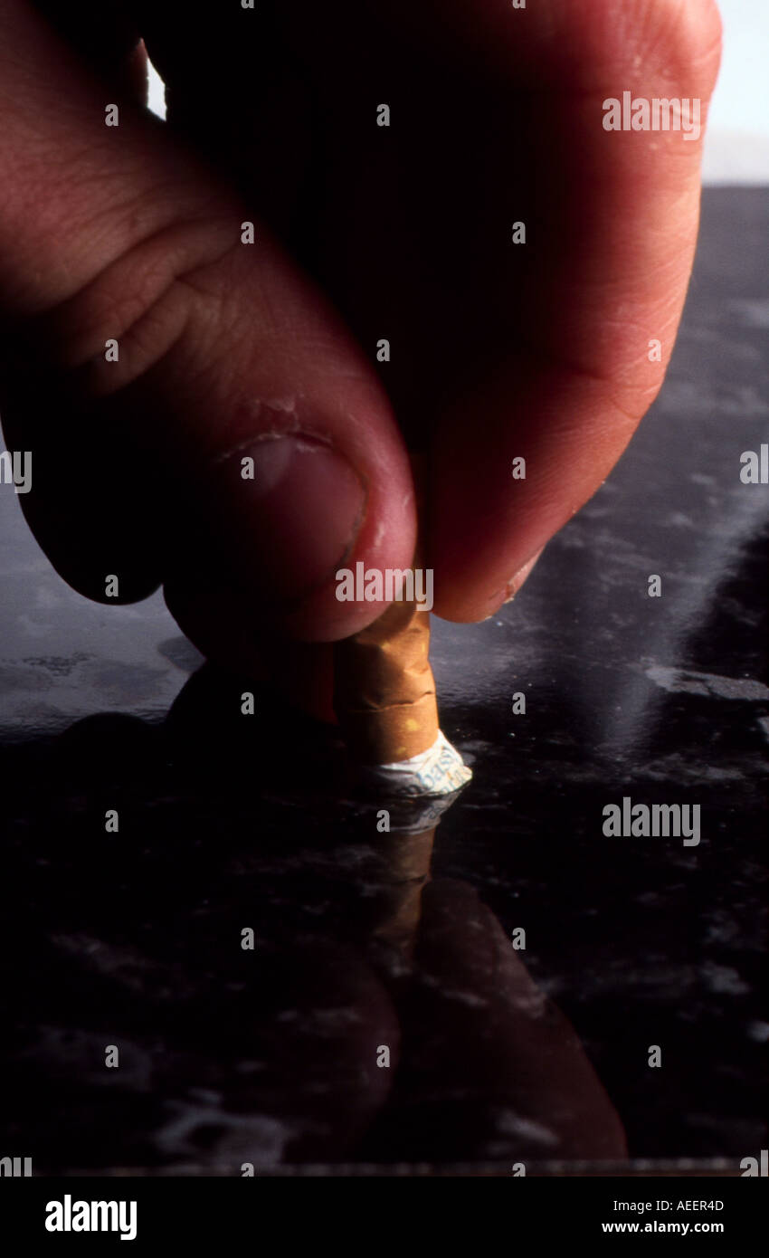 Cigarette being stubbed out Stock Photo - Alamy