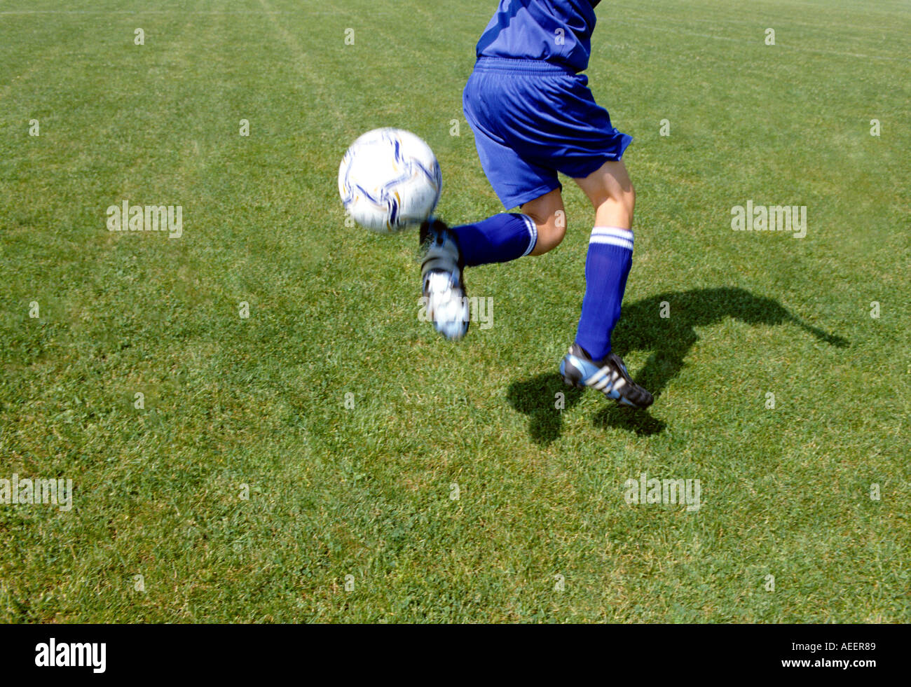 football player doing the backheel trick Stock Photo - Alamy