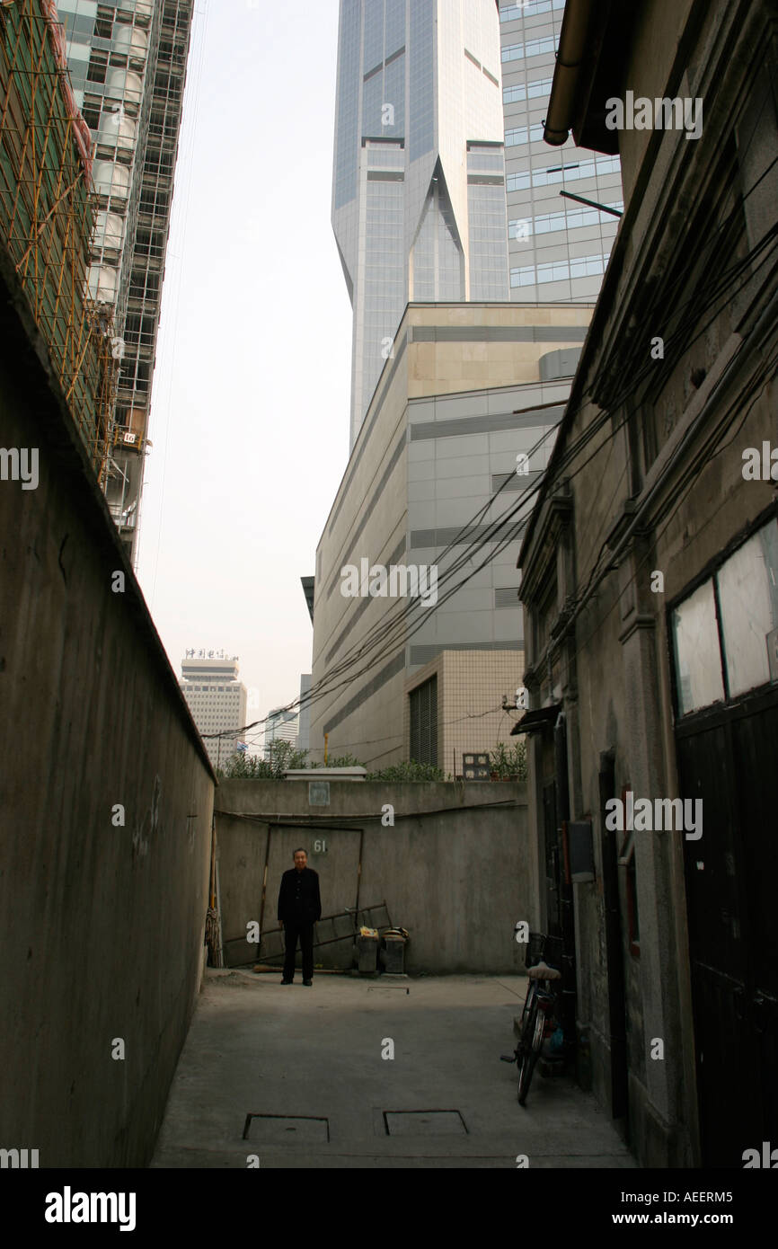 Shanghai China A man stands at the corner of a street shortly to be ...