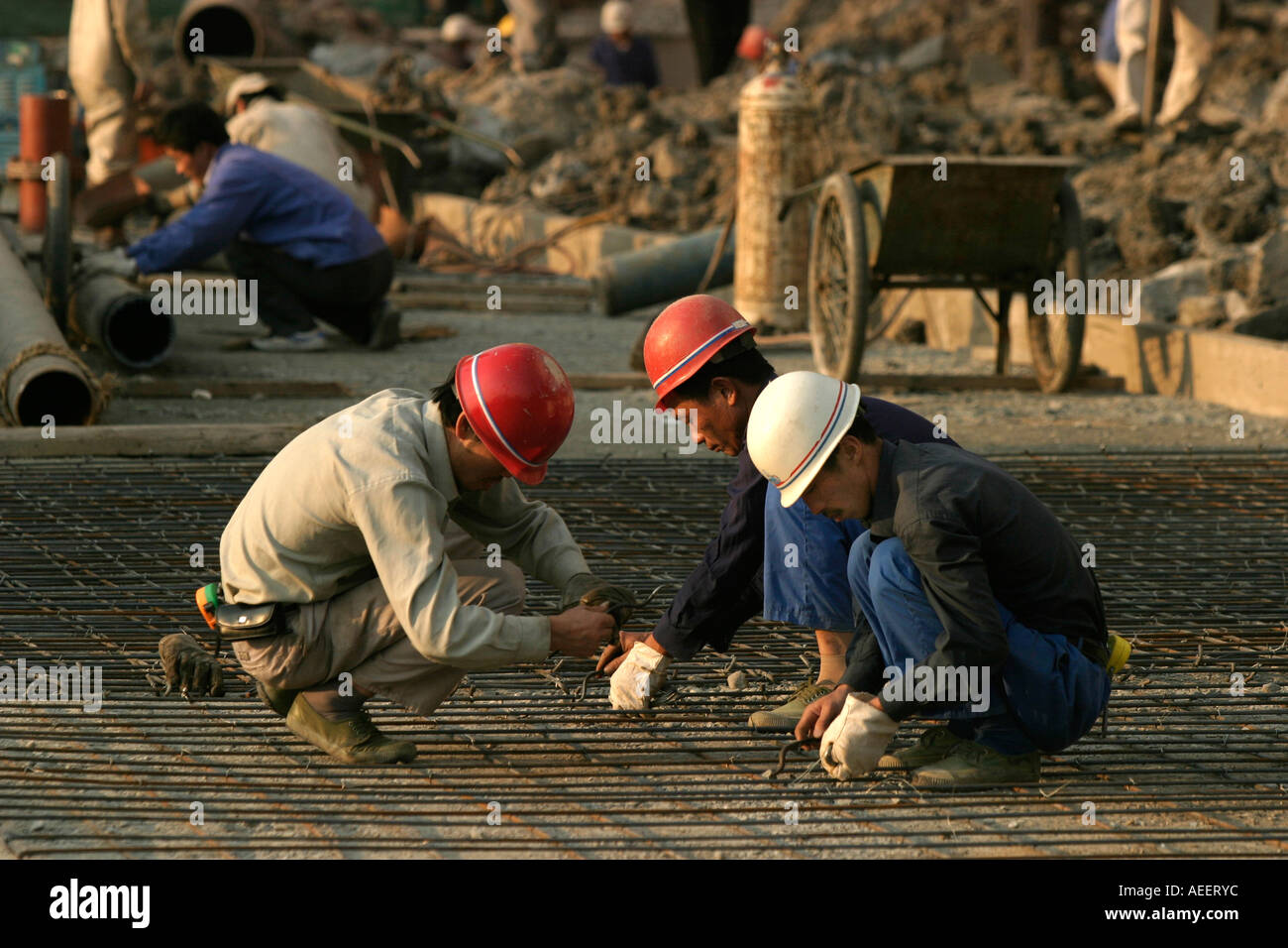 Shanghai China Construction workers completing road works on Xizang ...